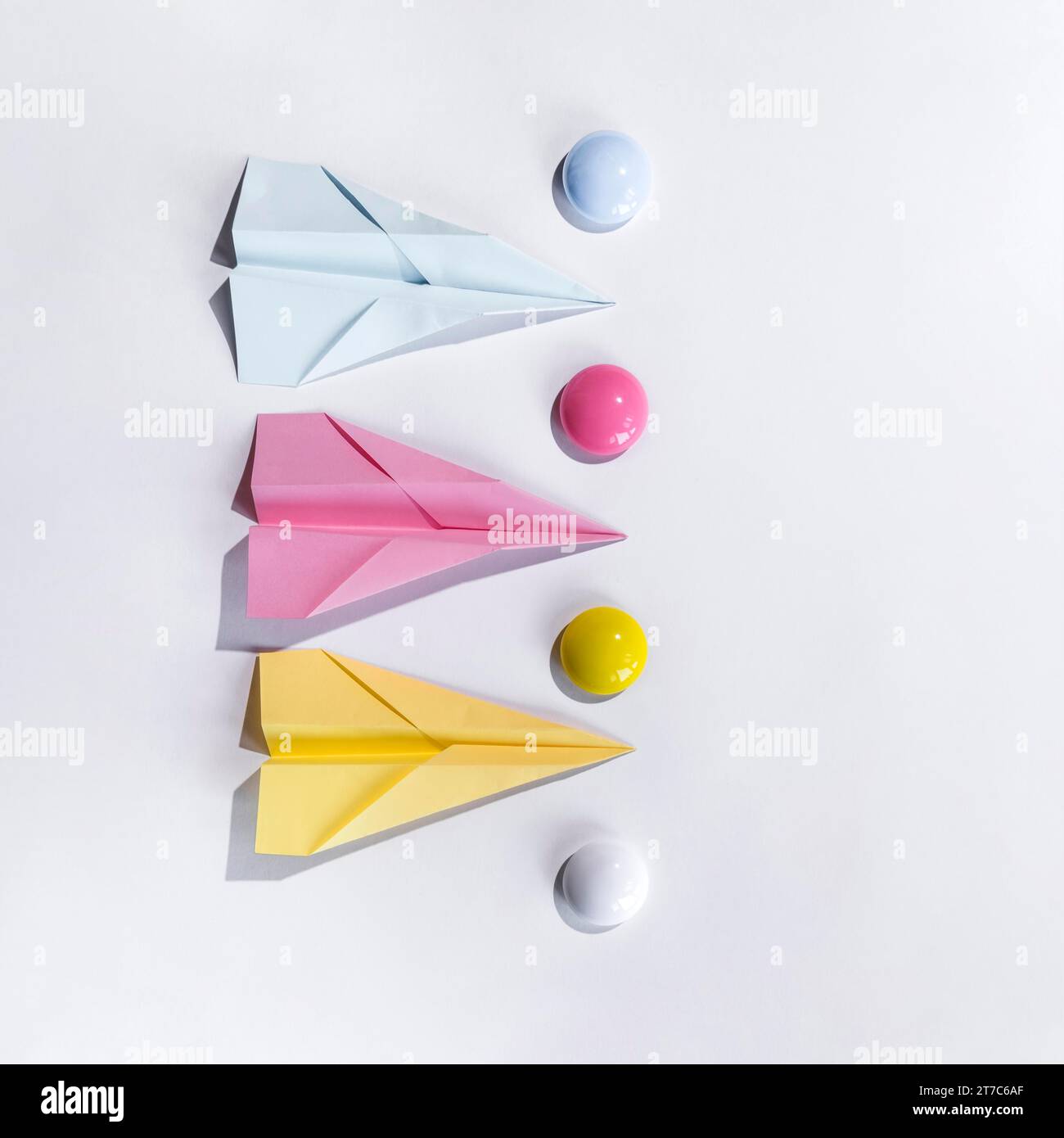 Composition with paper airplane table Stock Photo - Alamy