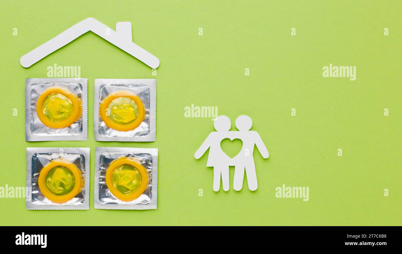 Contraception method arrangement green background Stock Photo - Alamy