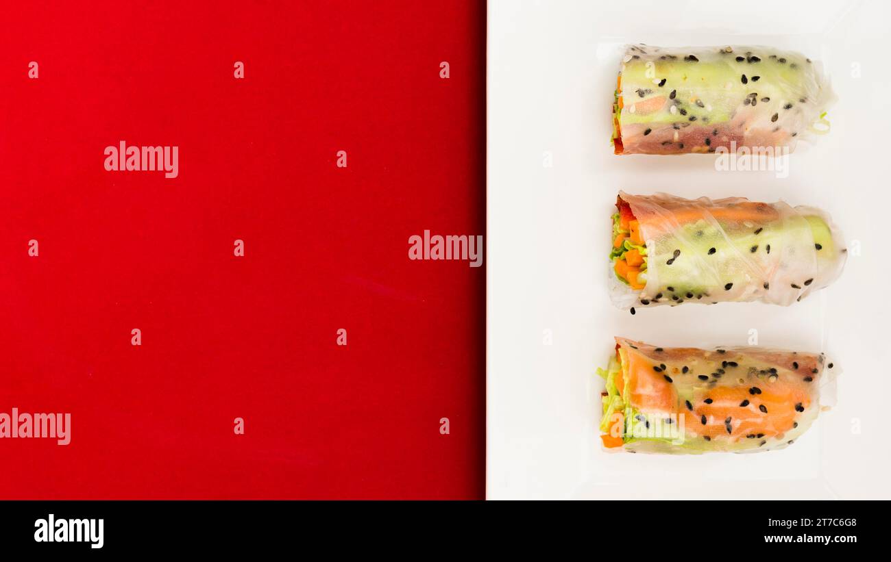 Elevated view fresh vegetable salmon fish spring rolls plate Stock ...