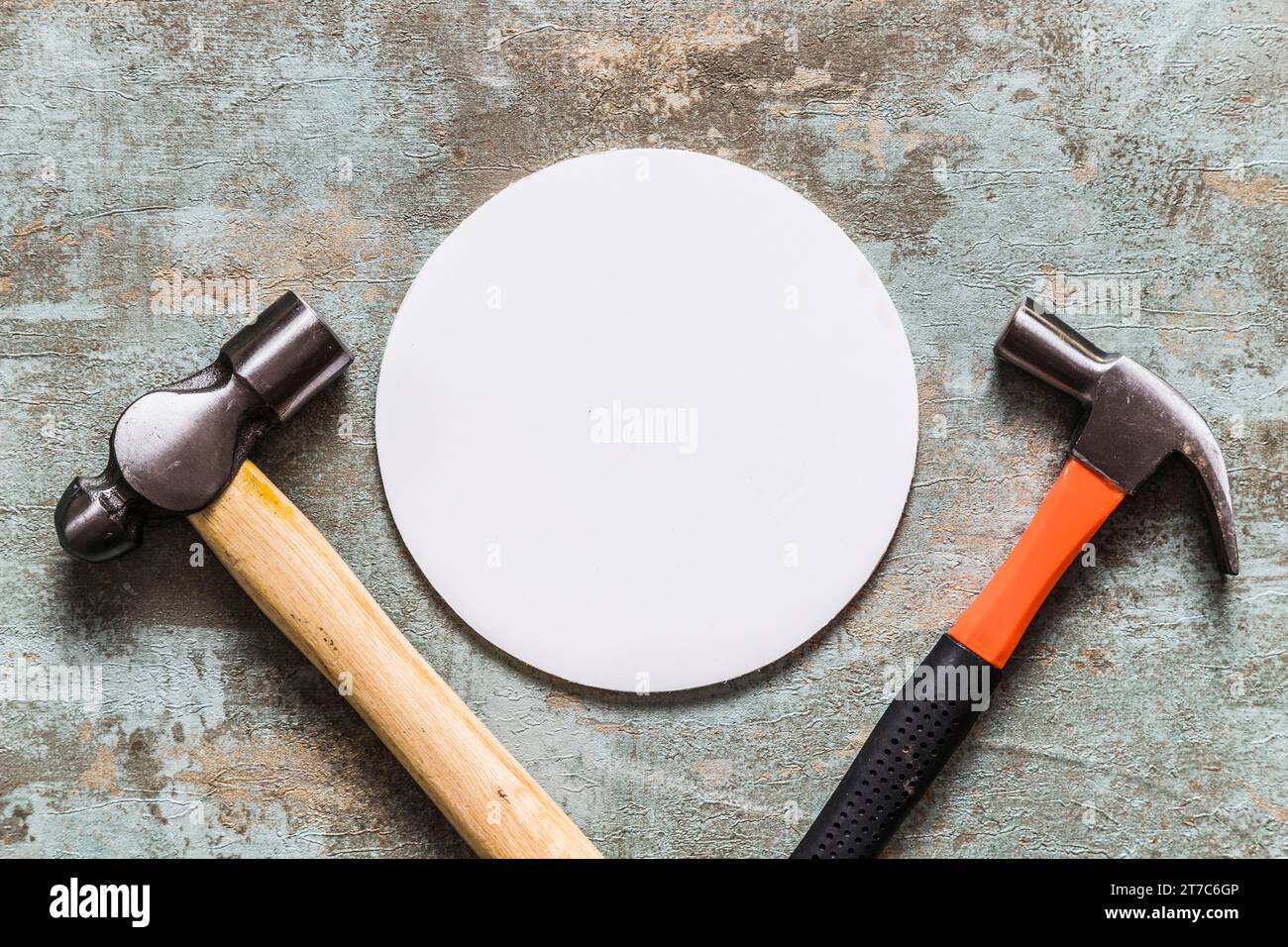 Elevated view white circular frame two hammers Stock Photo - Alamy
