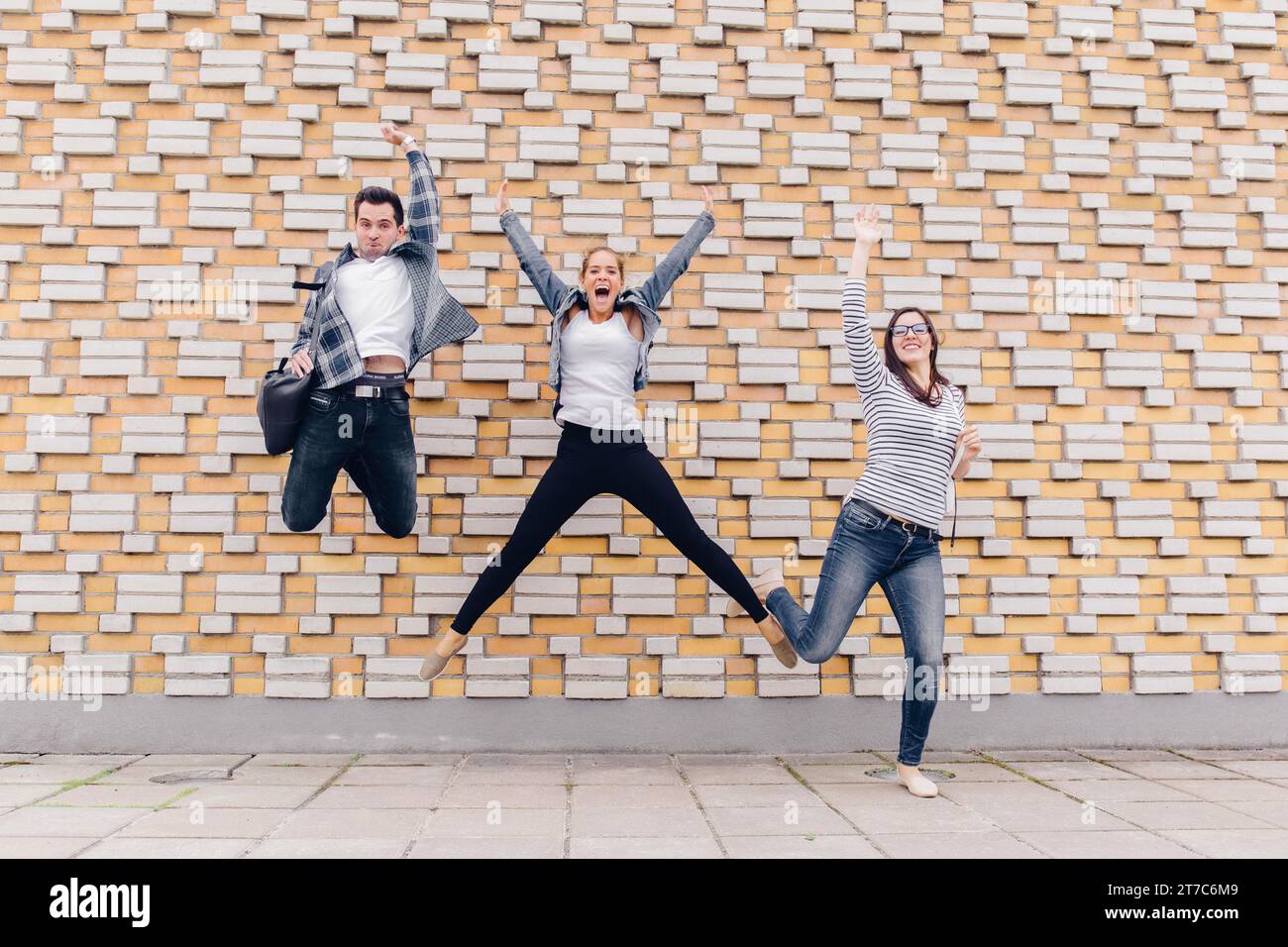 Friendship jump hi-res stock photography and images - Alamy