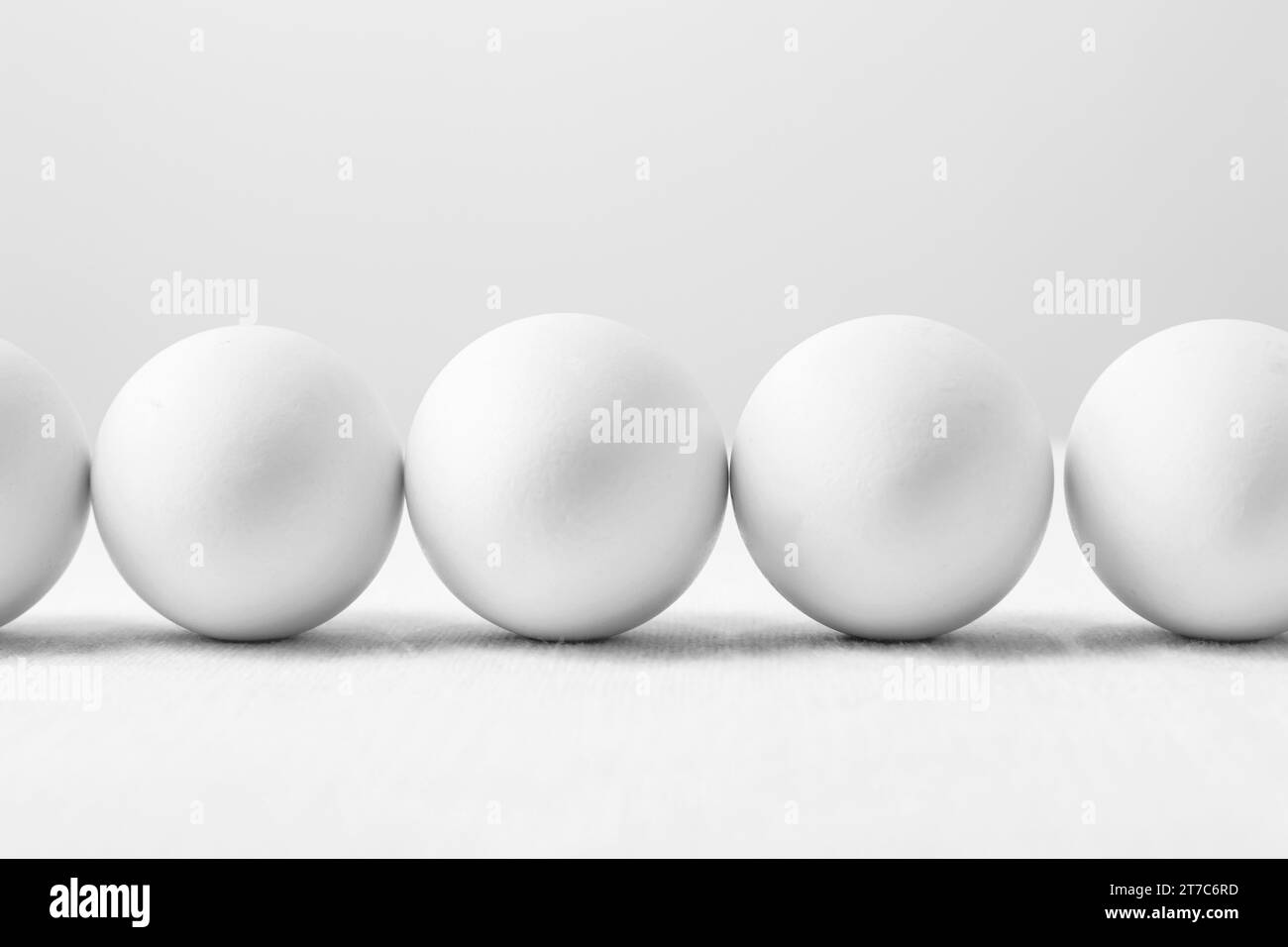 Front view white eggs table Stock Photo - Alamy