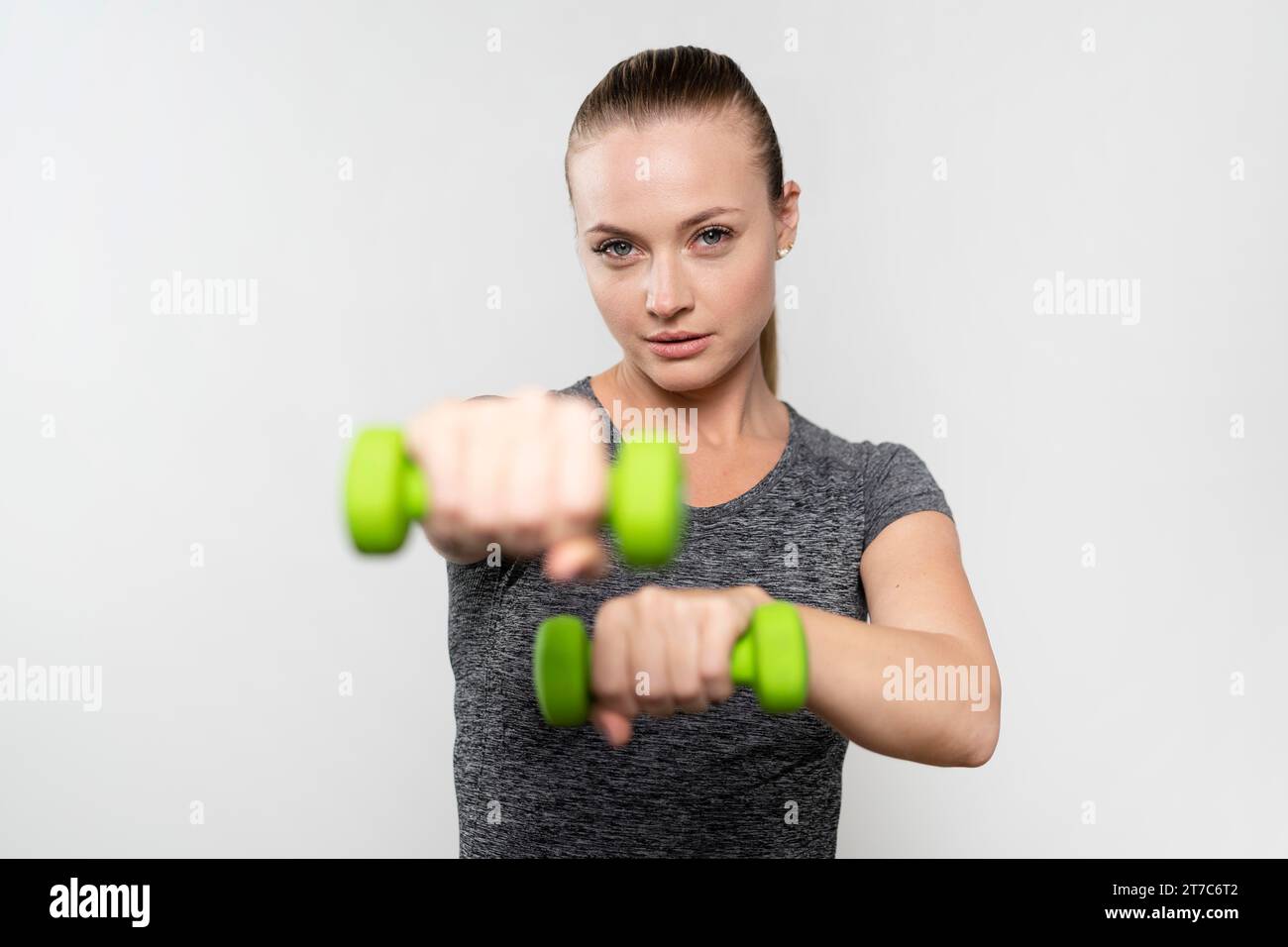 Front view woman with physiotherapy weights Stock Photo - Alamy
