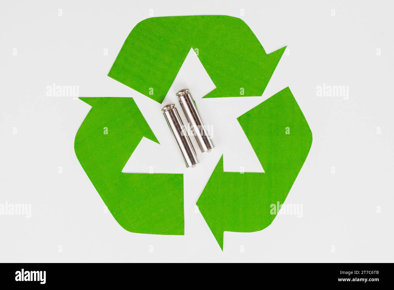 Green eco recycle symbol used batteries Stock Photo - Alamy