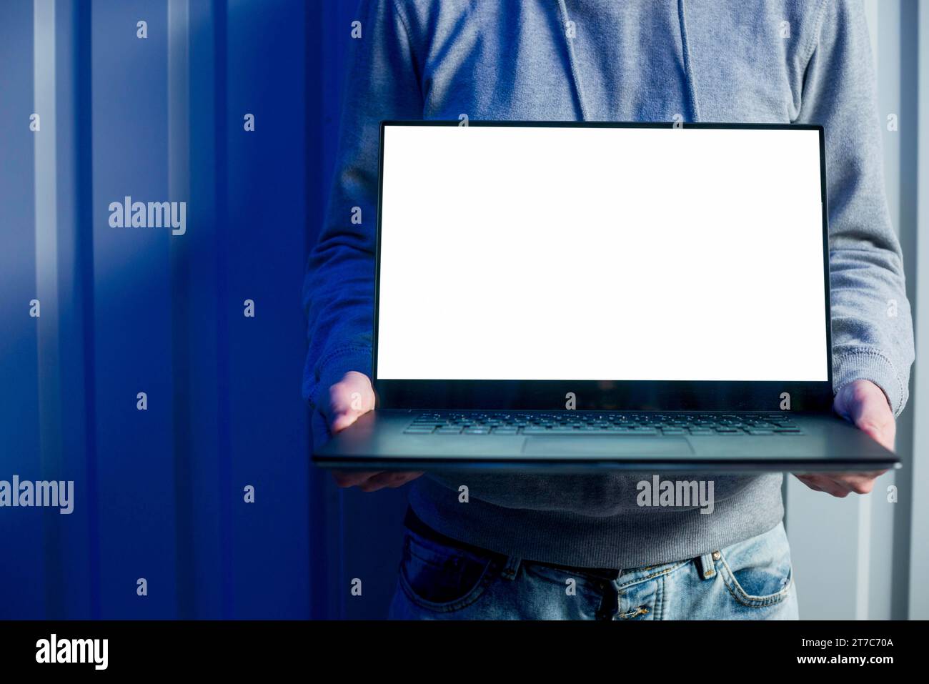 Hacker presenting laptop template Stock Photo - Alamy