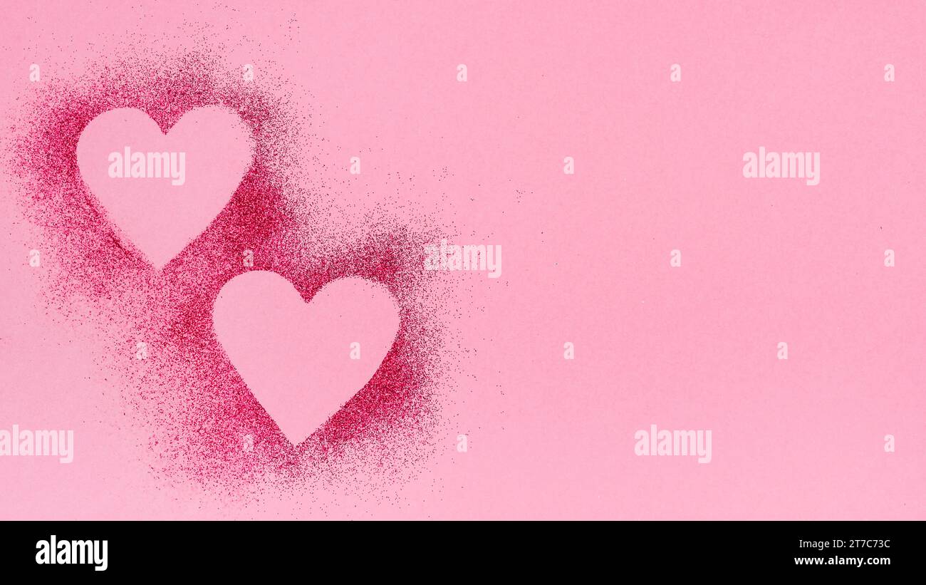 Heart shapes from glitter powder Stock Photo - Alamy