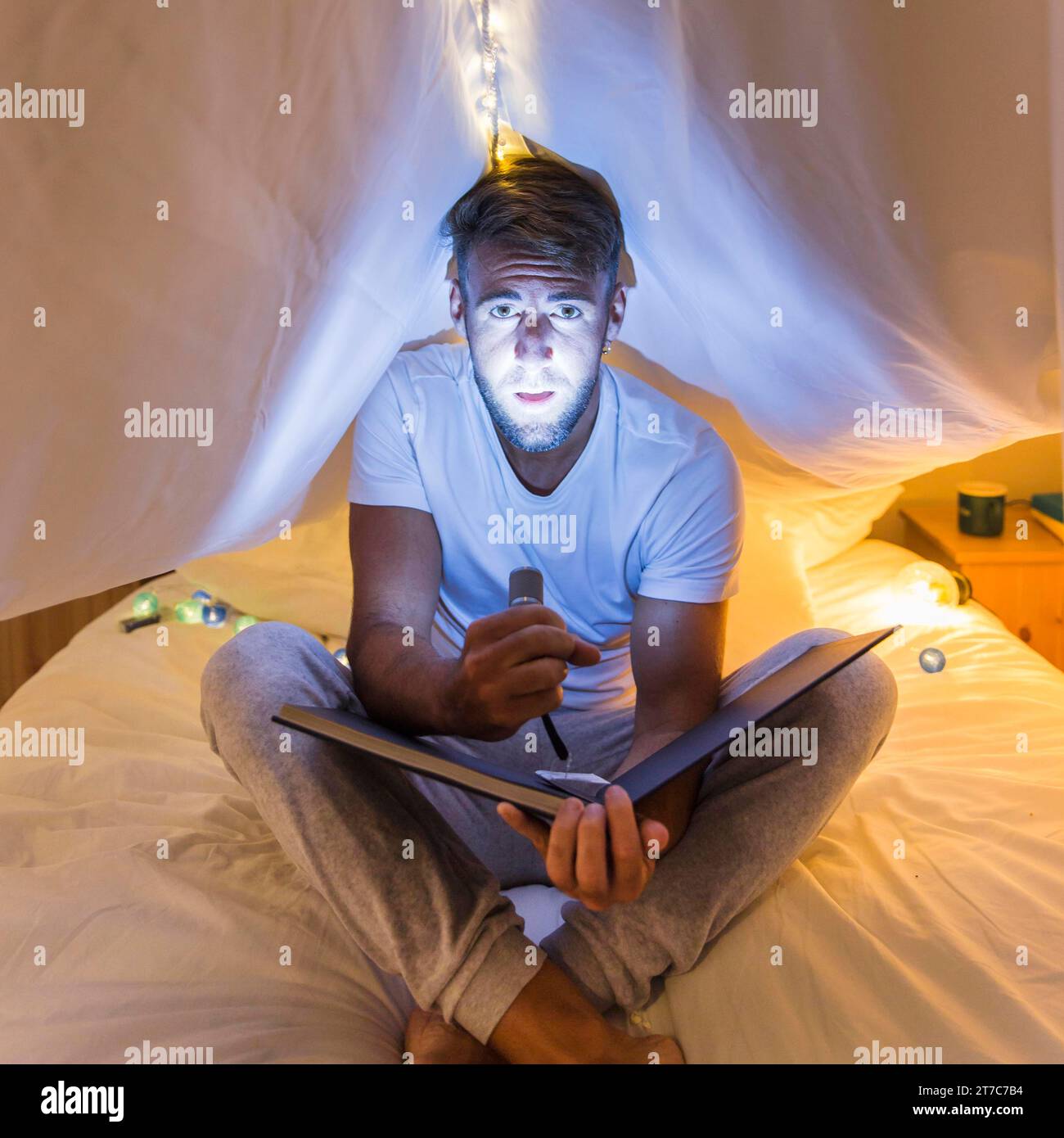 Man holding torch flashlight hi-res stock photography and images - Alamy