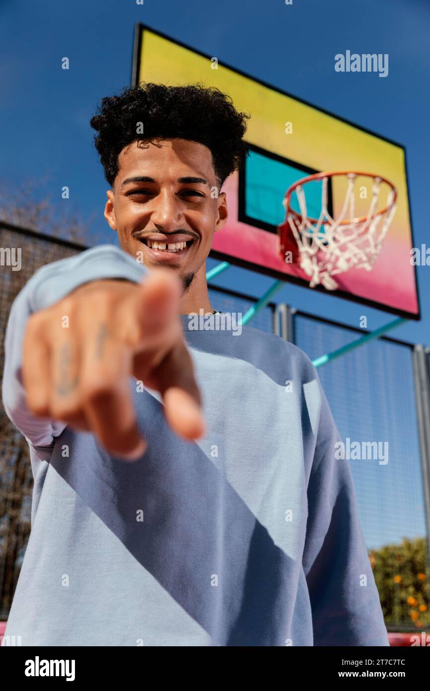 Portrait young man outdoor pointing Stock Photo - Alamy