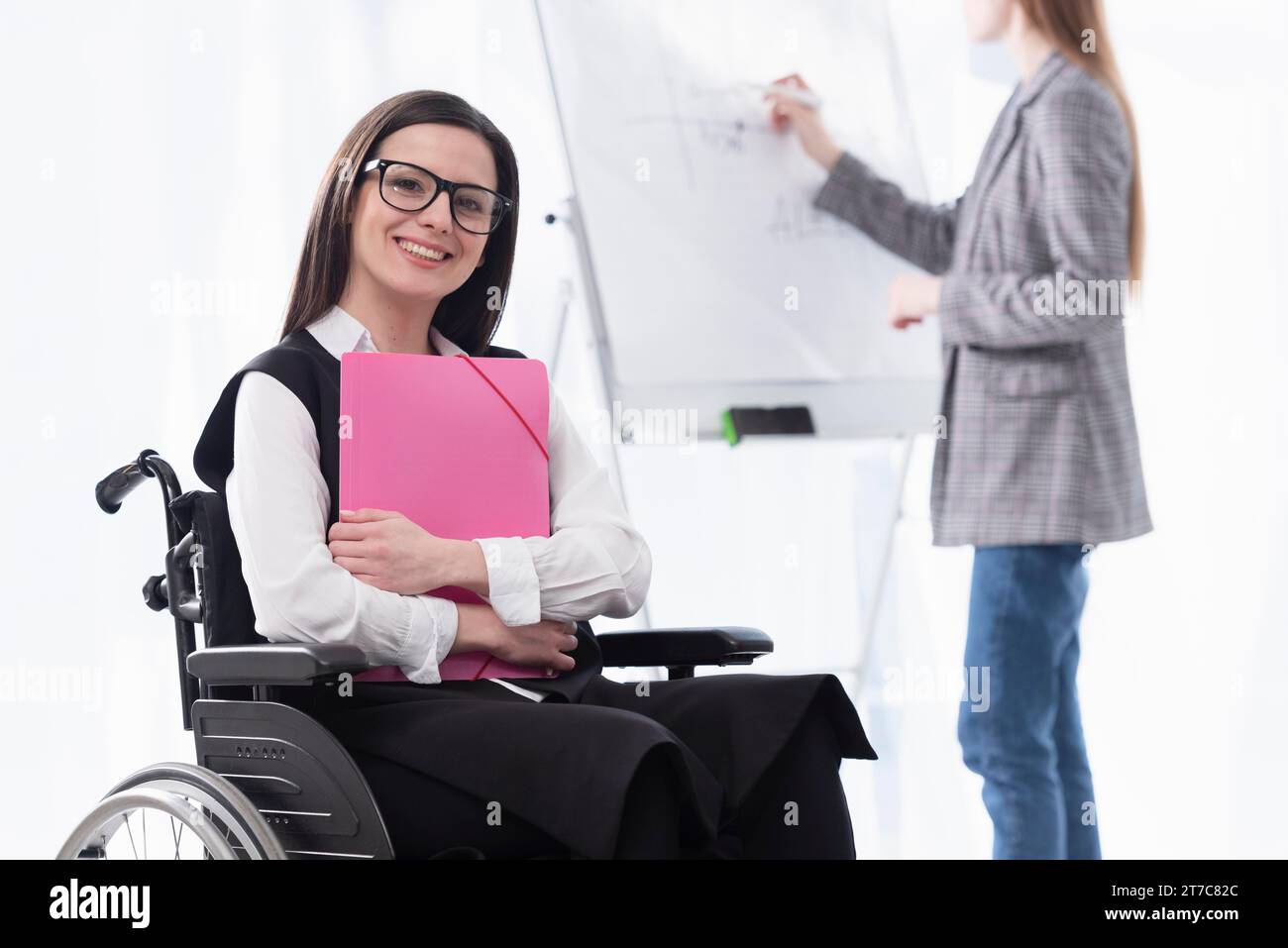 Smiley woman wheelchair Stock Photo - Alamy