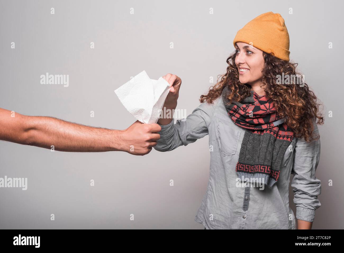 Smiling sick woman taking tissue paper from man s hand Stock Photo - Alamy
