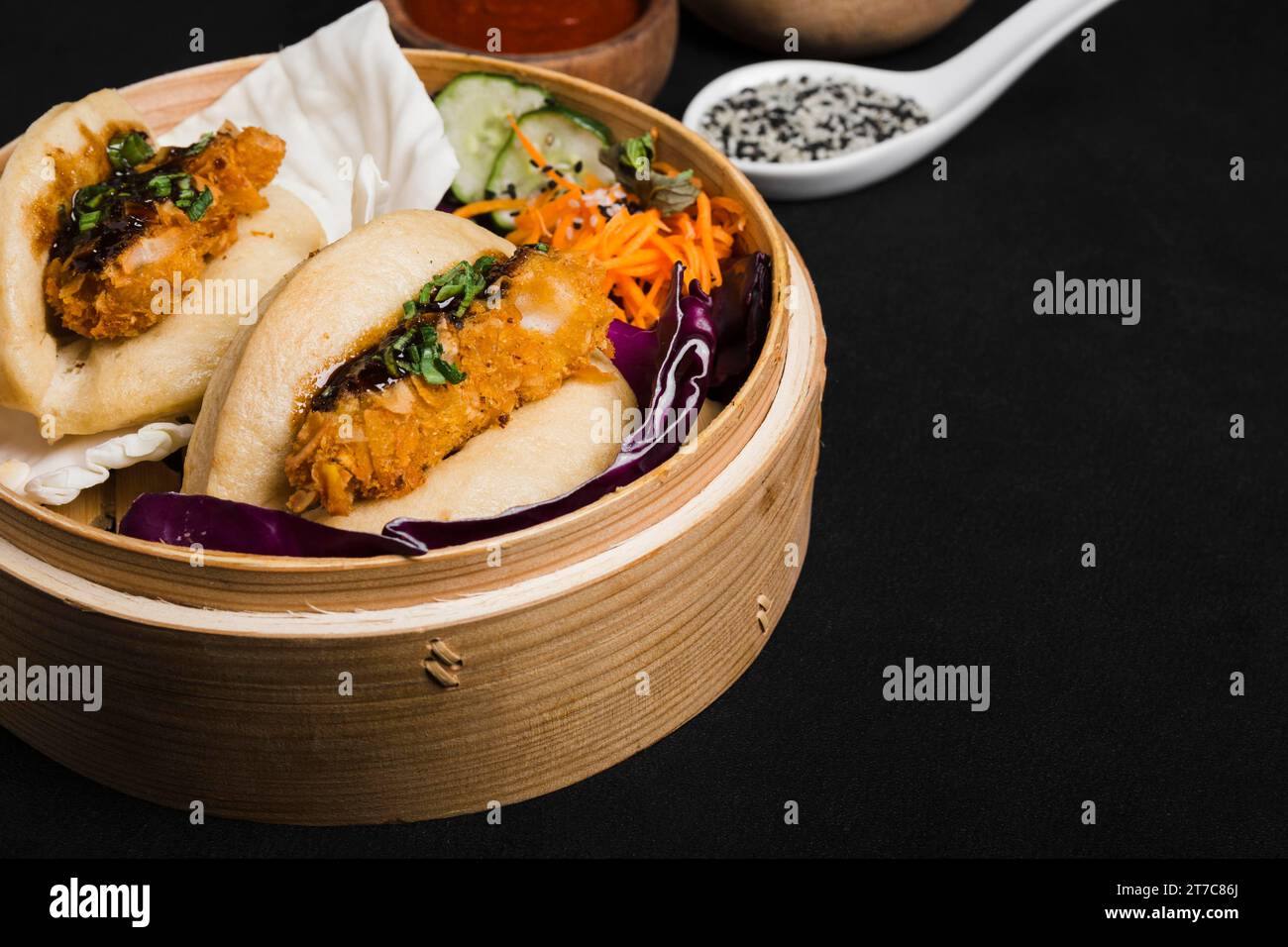 Steamed sandwich bamboo steamer with salad black background Stock Photo ...