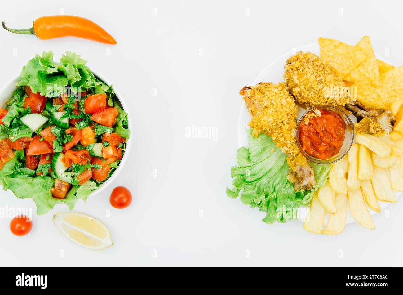 Top view fried chicken vs salad Stock Photo - Alamy