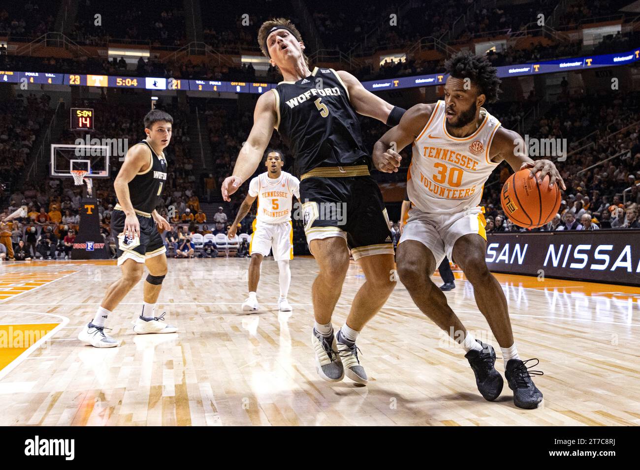 Tennessee guard Josiah-Jordan James (30) collides with Wofford guard ...
