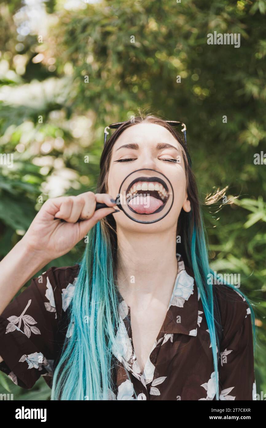 Woman showing tongue hi-res stock photography and images - Alamy