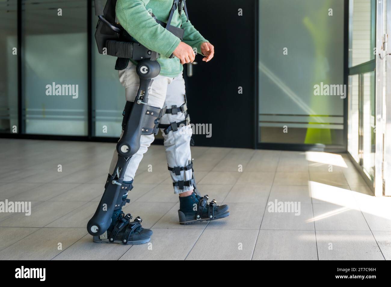 Mechanical exoskeleton, disabled person walking with the help of ...
