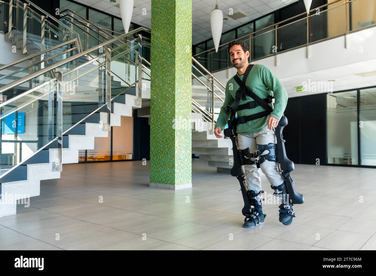 Mechanical exoskeleton, disabled person walking with the help of ...