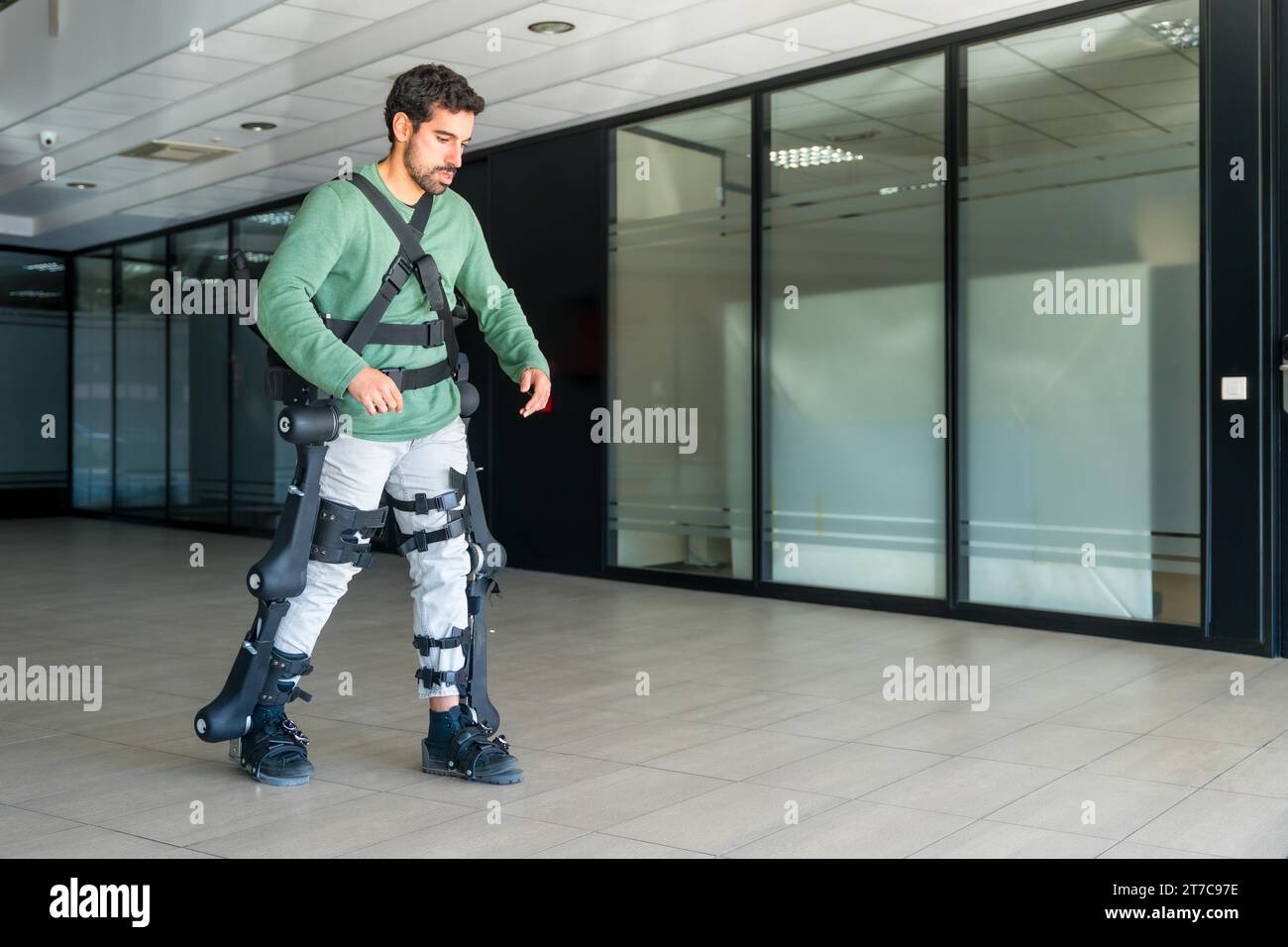 Mechanical exoskeleton, disabled person walking with the help of ...