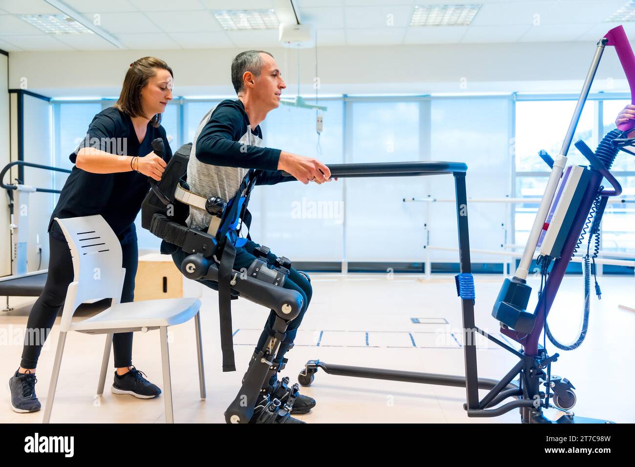 Mechanical exoskeleton. Physiotherapy medical assistant lifting ...