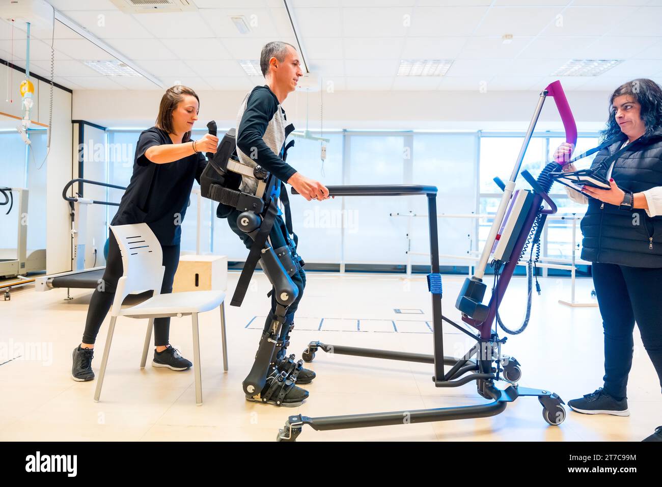Mechanical exoskeleton. Physiotherapy medical assistant lifting ...