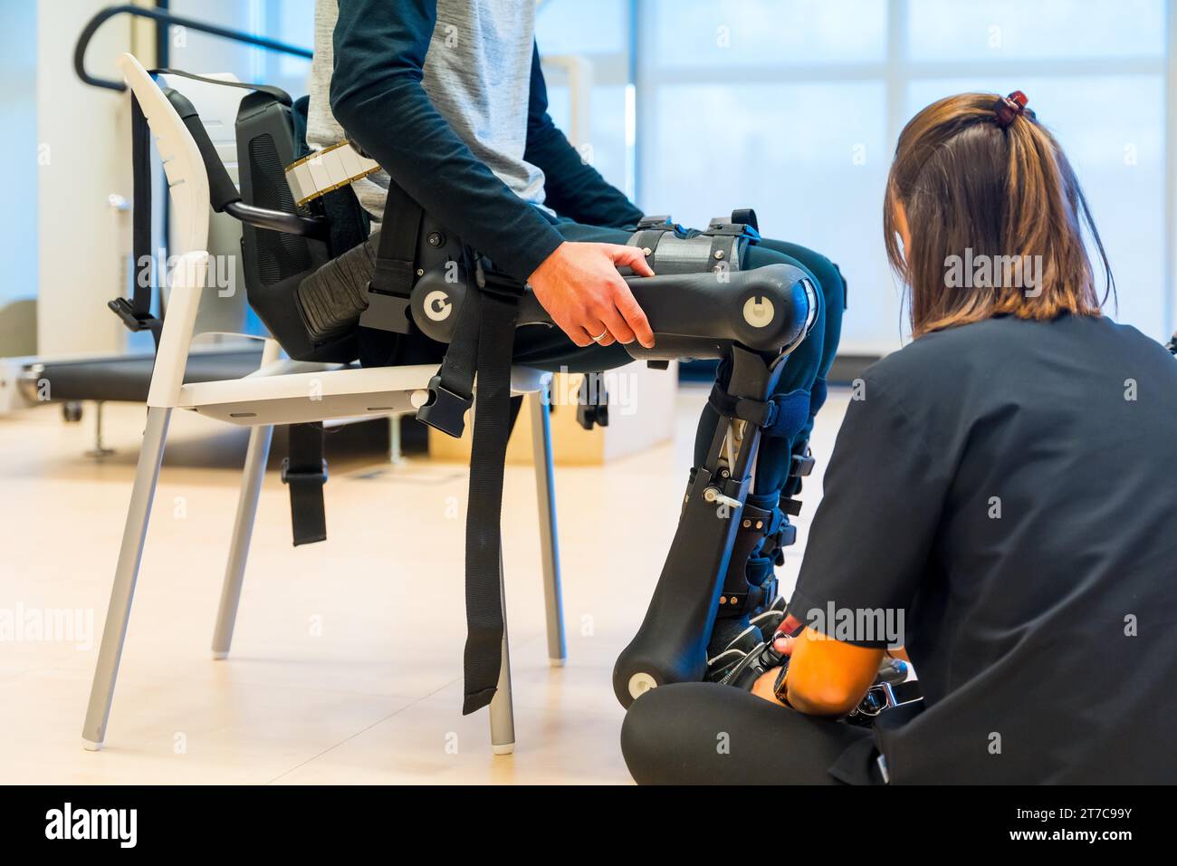 Mechanical exoskeleton. Physiotherapy in a modern hospital: Female ...