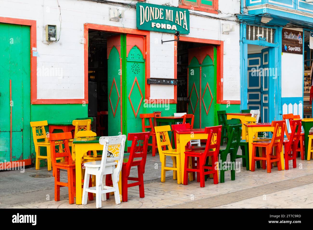 Historic Paisa style houses, outdoor seating of a restaurant, Plaza de ...
