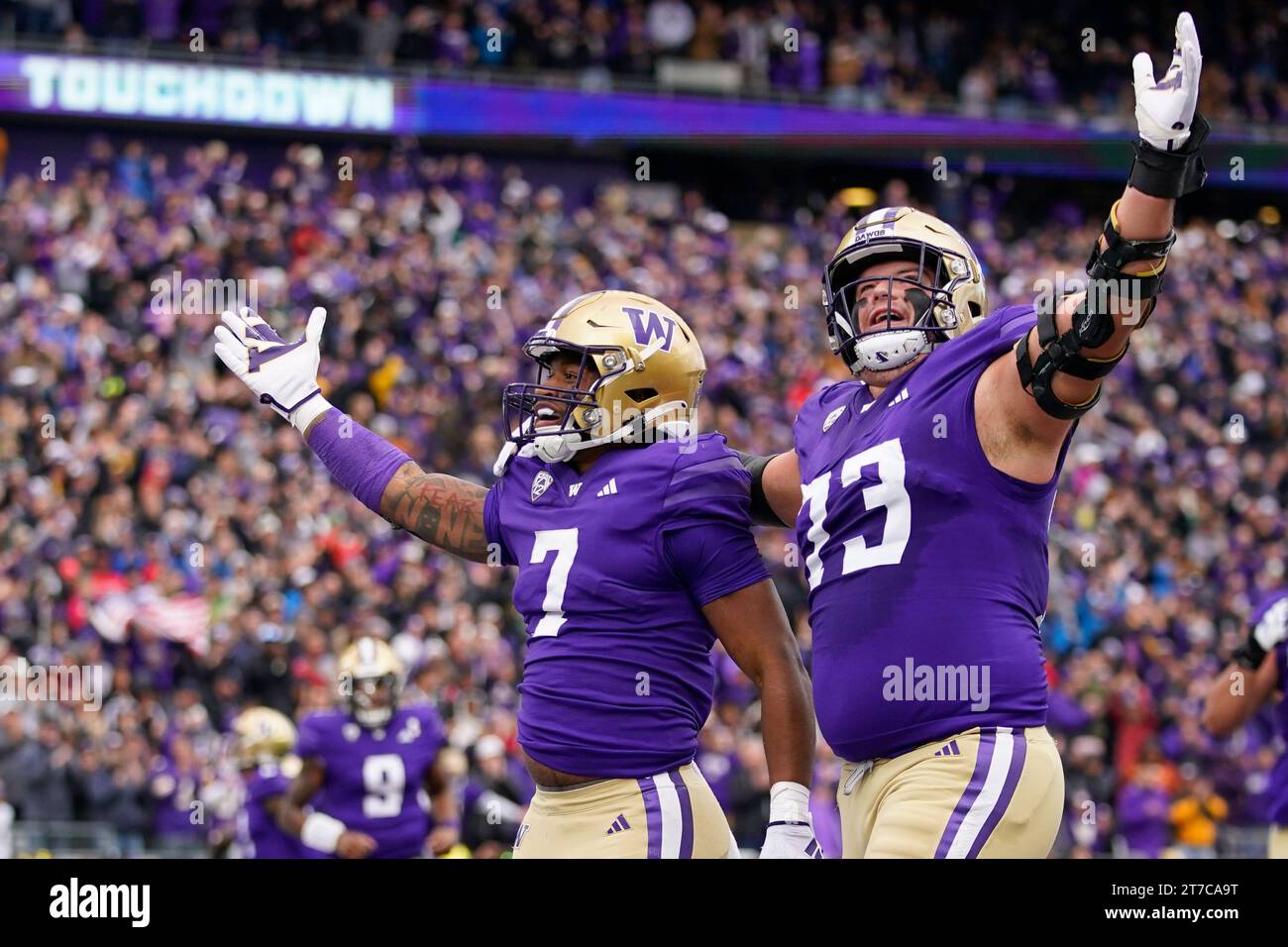 Washington running back Dillon Johnson (7) gestures to fans with ...