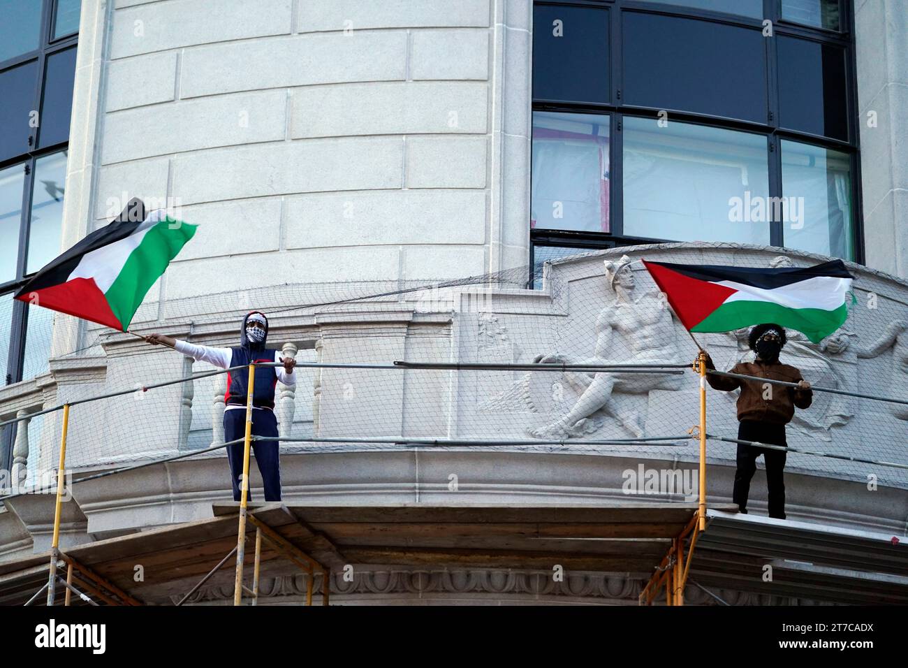 Demonstrators wave flags during a protest denouncing the Israel-Hamas ...