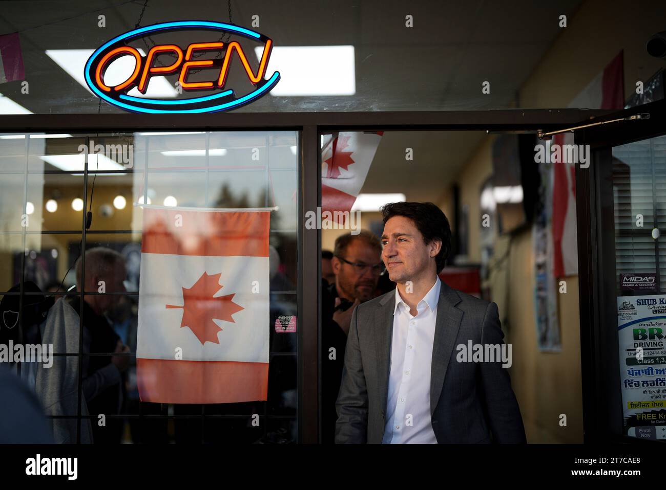 Prime Minister Justin Trudeau leaves a small business after stopping to ...