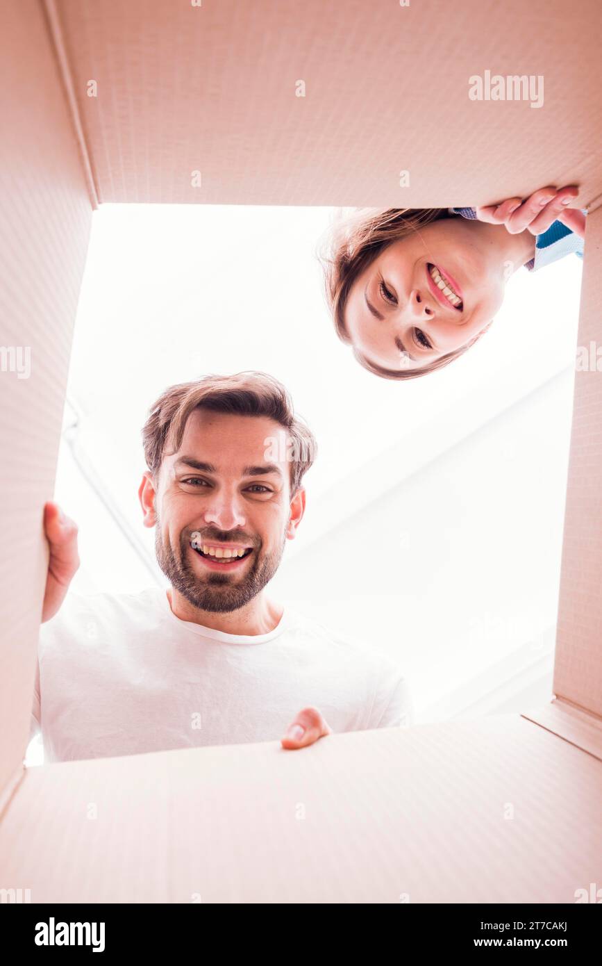 Curious couple inside bottom box view Stock Photo - Alamy
