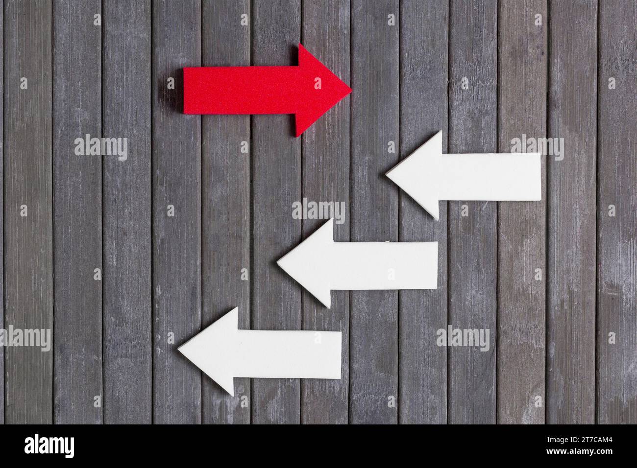 Crowd white arrows rebel red arrow going opposite direction Stock Photo ...