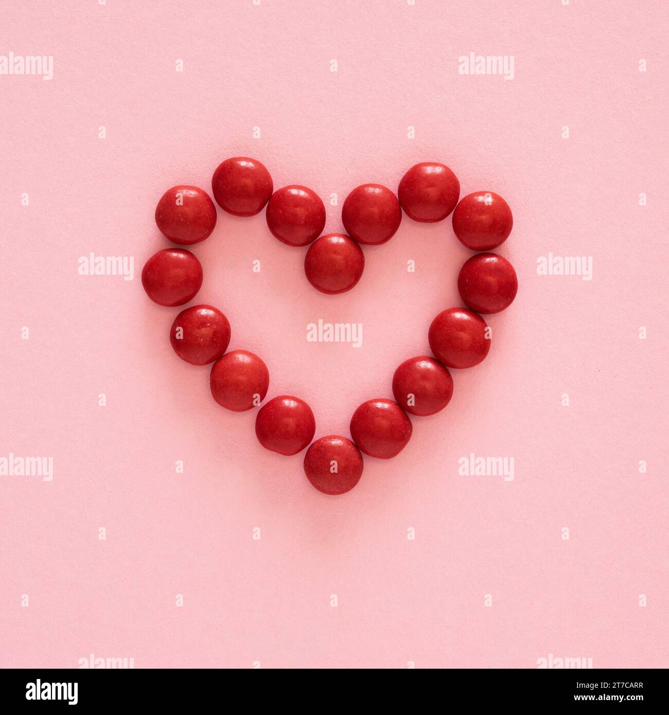 Flat lay heart shape candy arrangement Stock Photo - Alamy