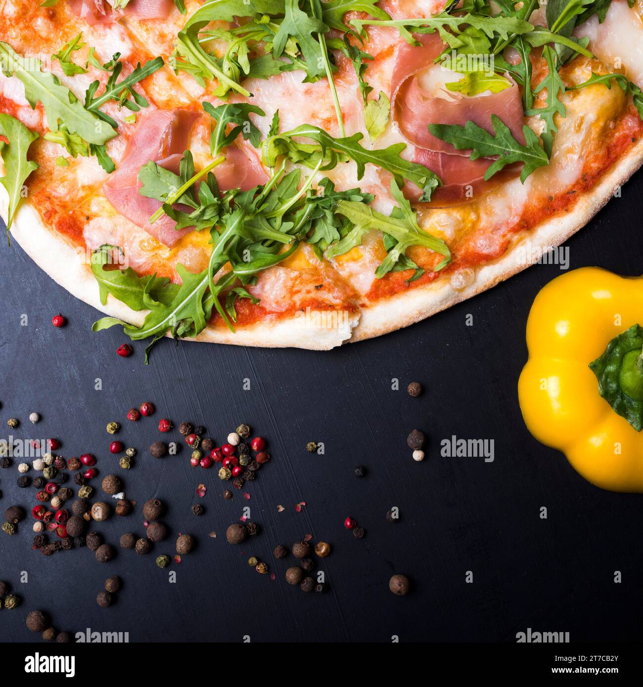 Italian pizza yellow bell pepper black pepper kitchen counter Stock ...