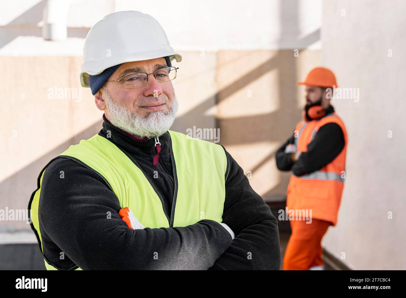 Medium shot men wearing helmet Stock Photo - Alamy