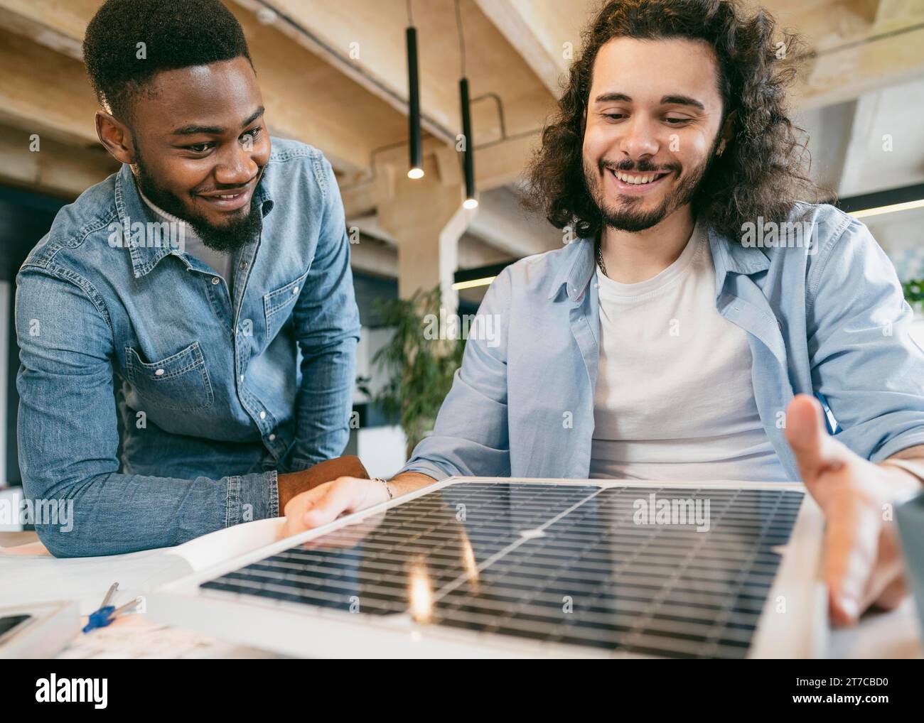 Medium shot smiley men with project Stock Photo - Alamy