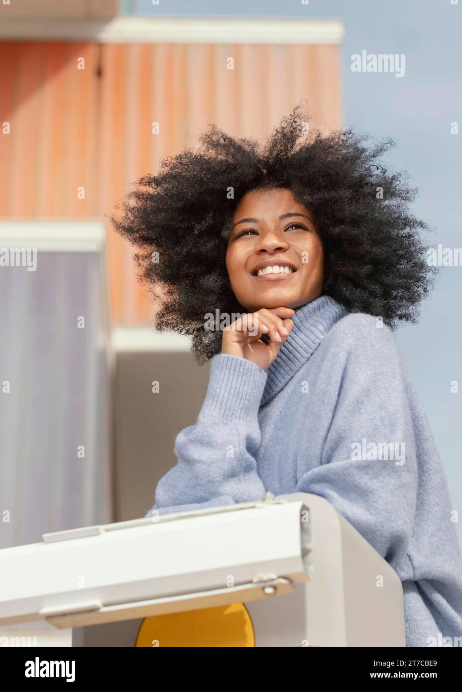 Medium shot smiley model posing Stock Photo - Alamy