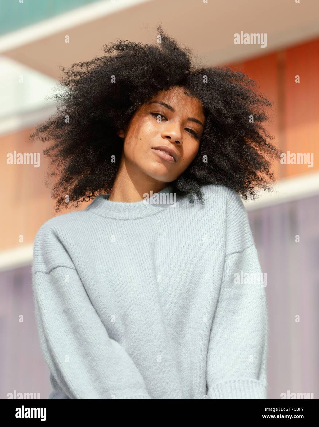 Medium shot woman posing outside Stock Photo - Alamy