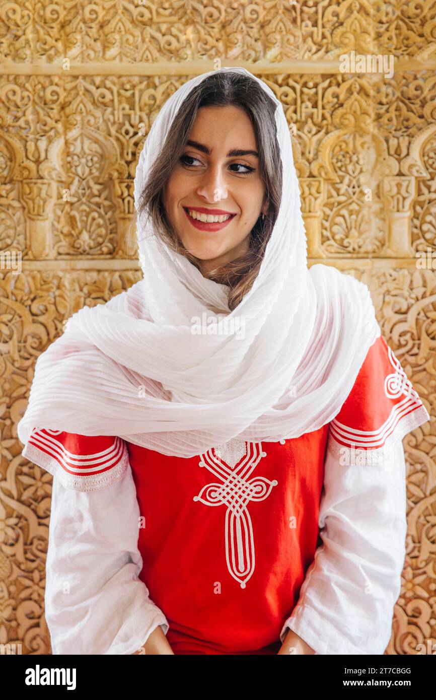 Muslim woman front golden wall Stock Photo - Alamy