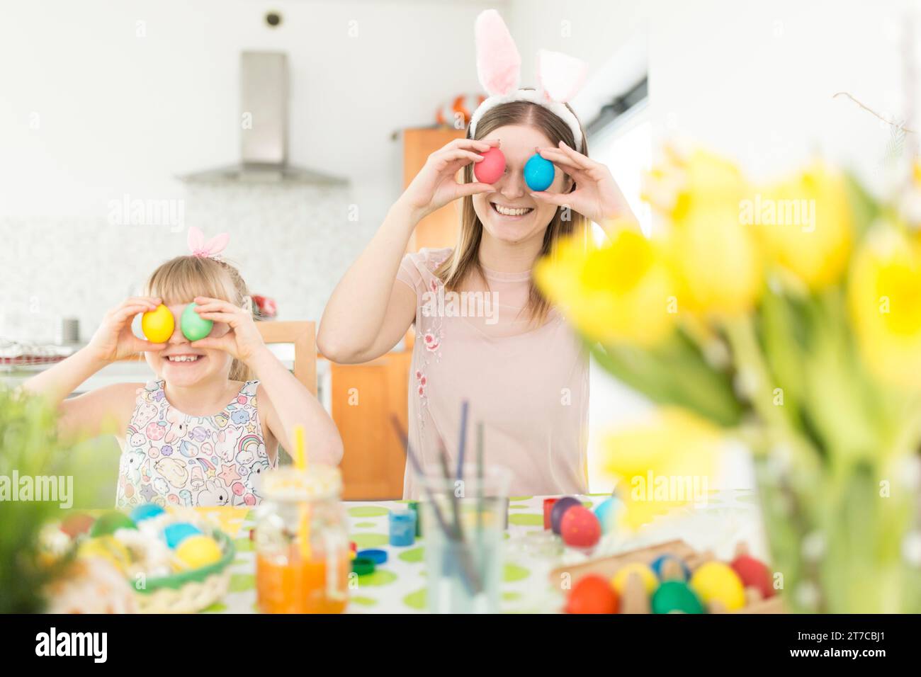 Mother daughter posing with easter eggs Stock Photo - Alamy