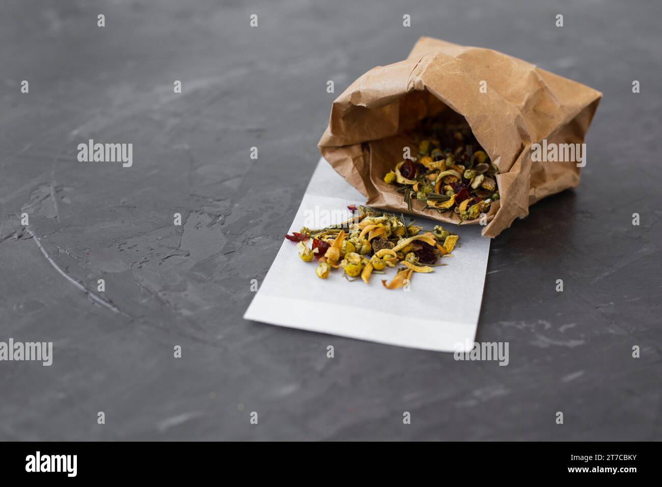 Paper bag filled with colorful tea buds Stock Photo - Alamy