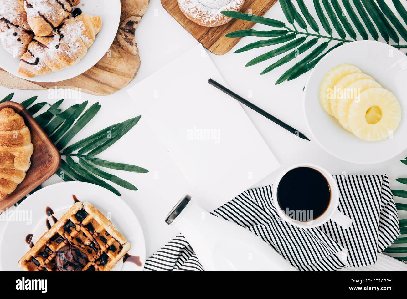 Pencil blank paper center breakfast white desk Stock Photo - Alamy
