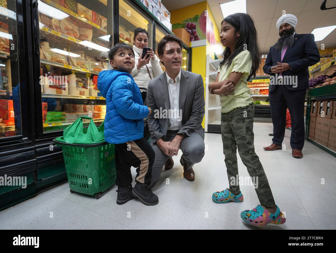 Prime Minister Justin Trudeau talks to children during a visit to a ...