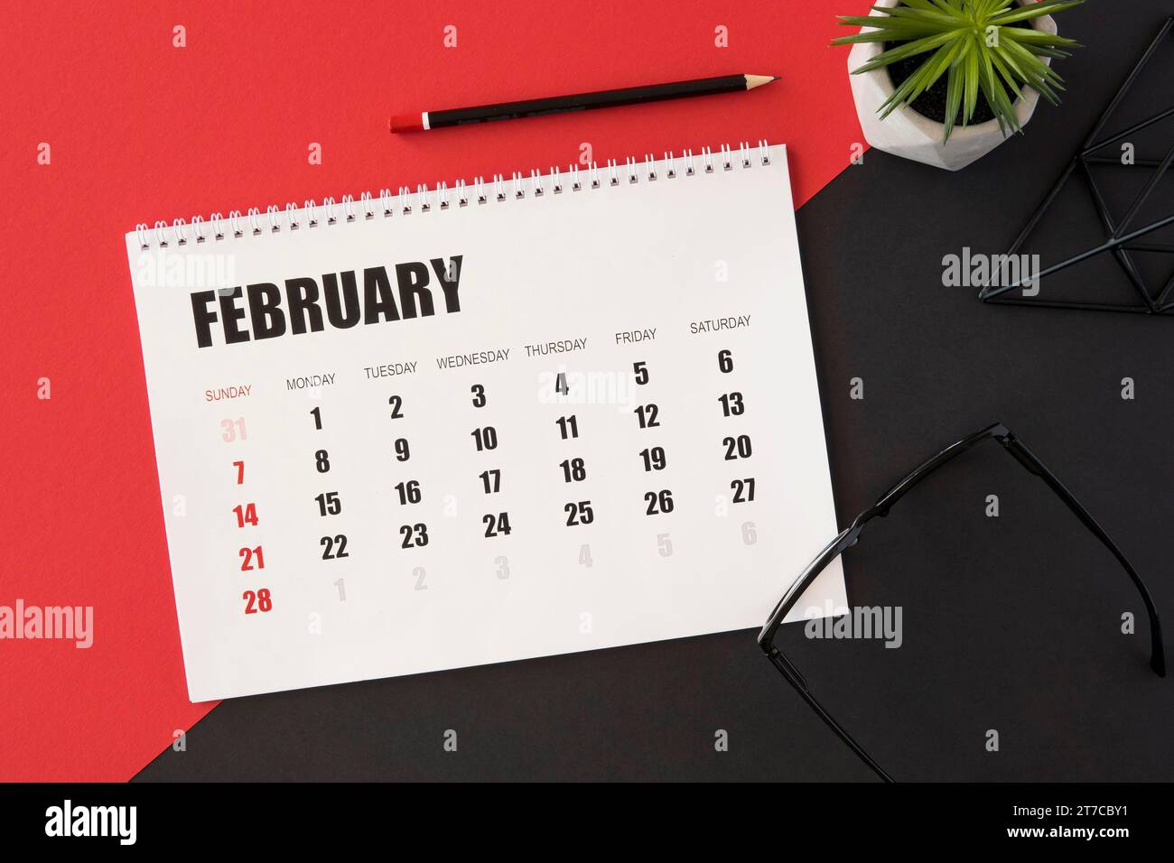 Planner calendar red black background Stock Photo - Alamy