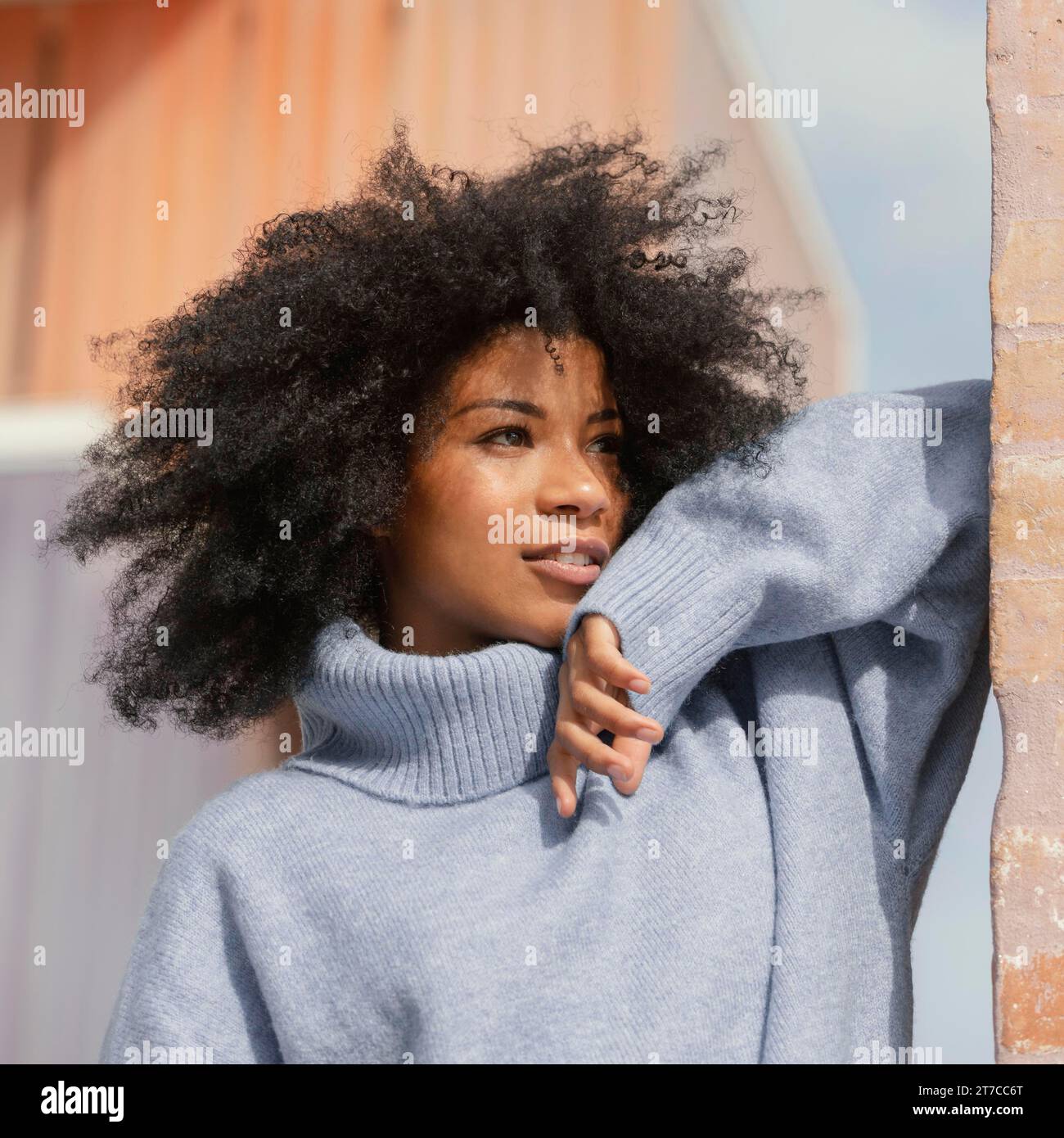 Smiley black model posing medium shot Stock Photo - Alamy