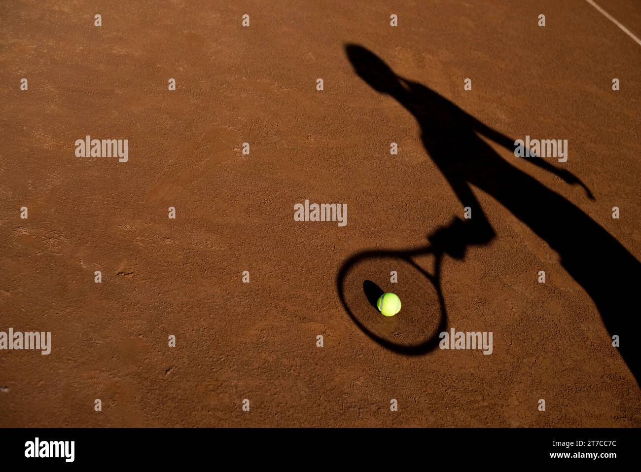 Shadow tennis player with ball Stock Photo - Alamy