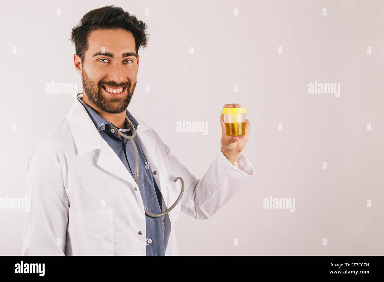 Smiley doctor with urine test Stock Photo - Alamy
