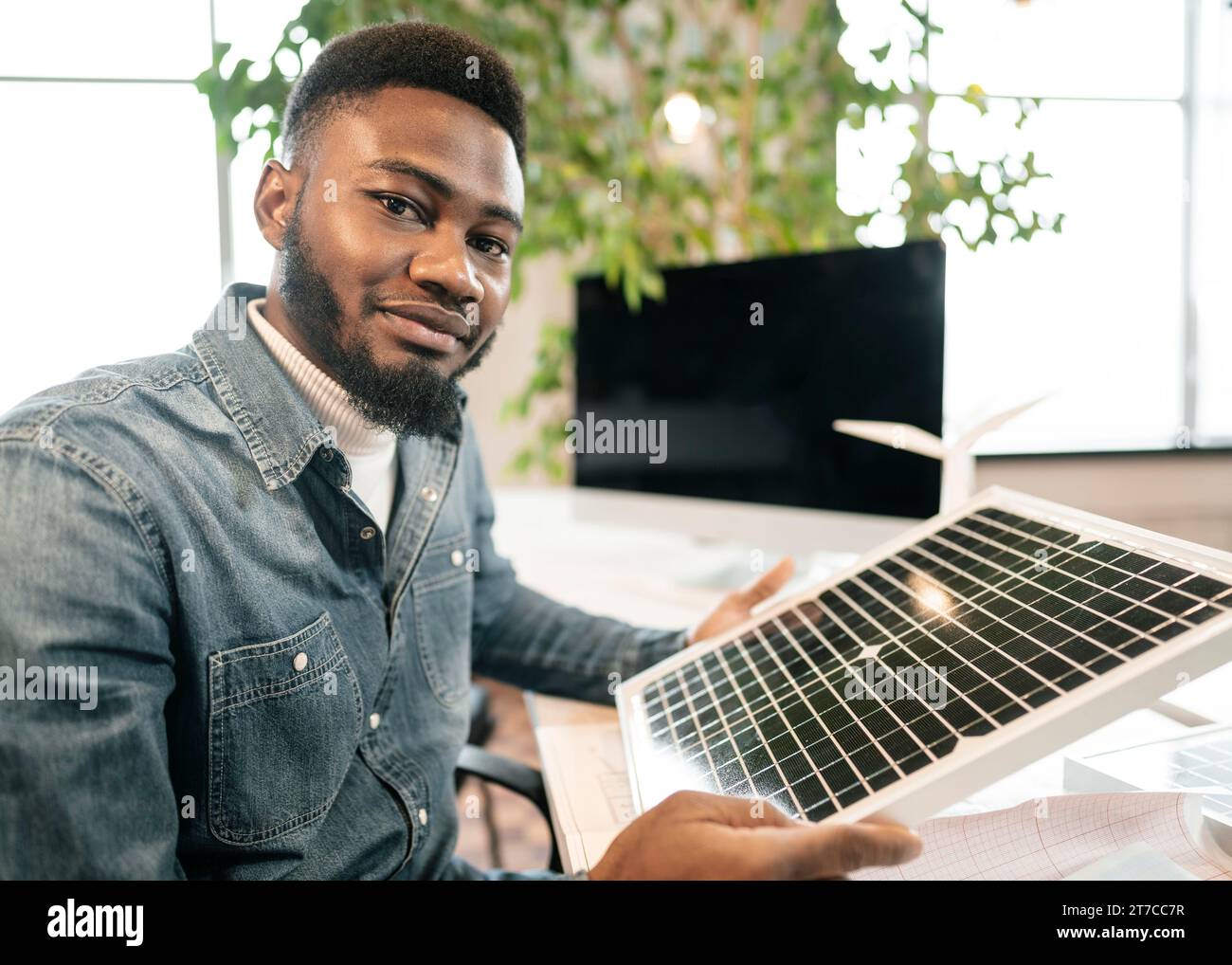 Smiley man working eco project Stock Photo - Alamy