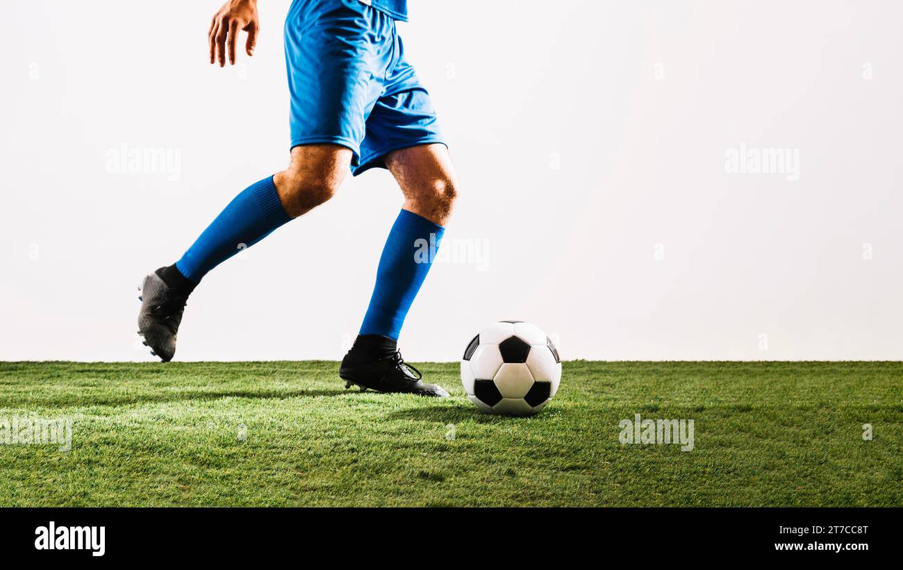Sportsman preparing kick ball Stock Photo - Alamy