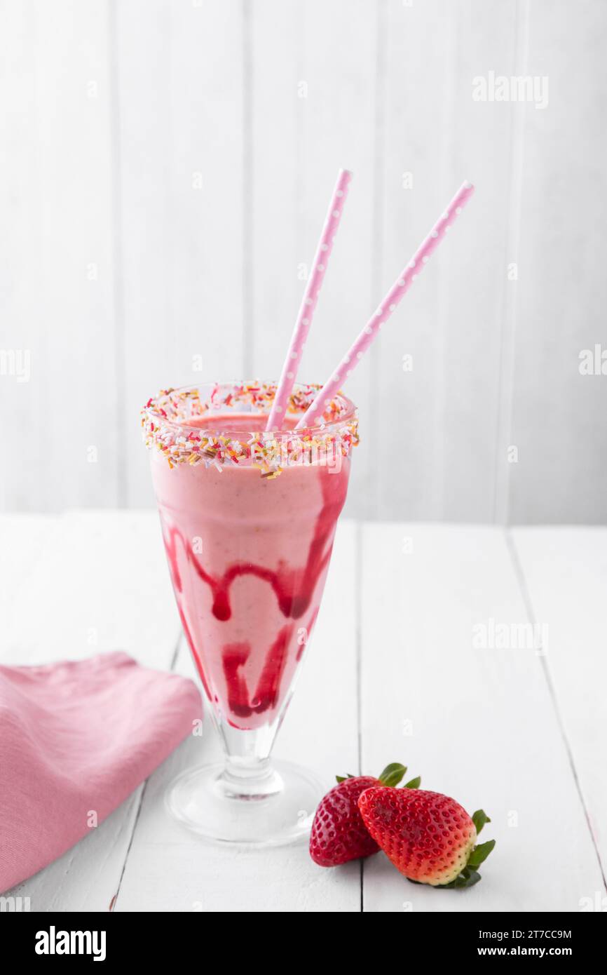 Strawberry milkshake table Stock Photo - Alamy
