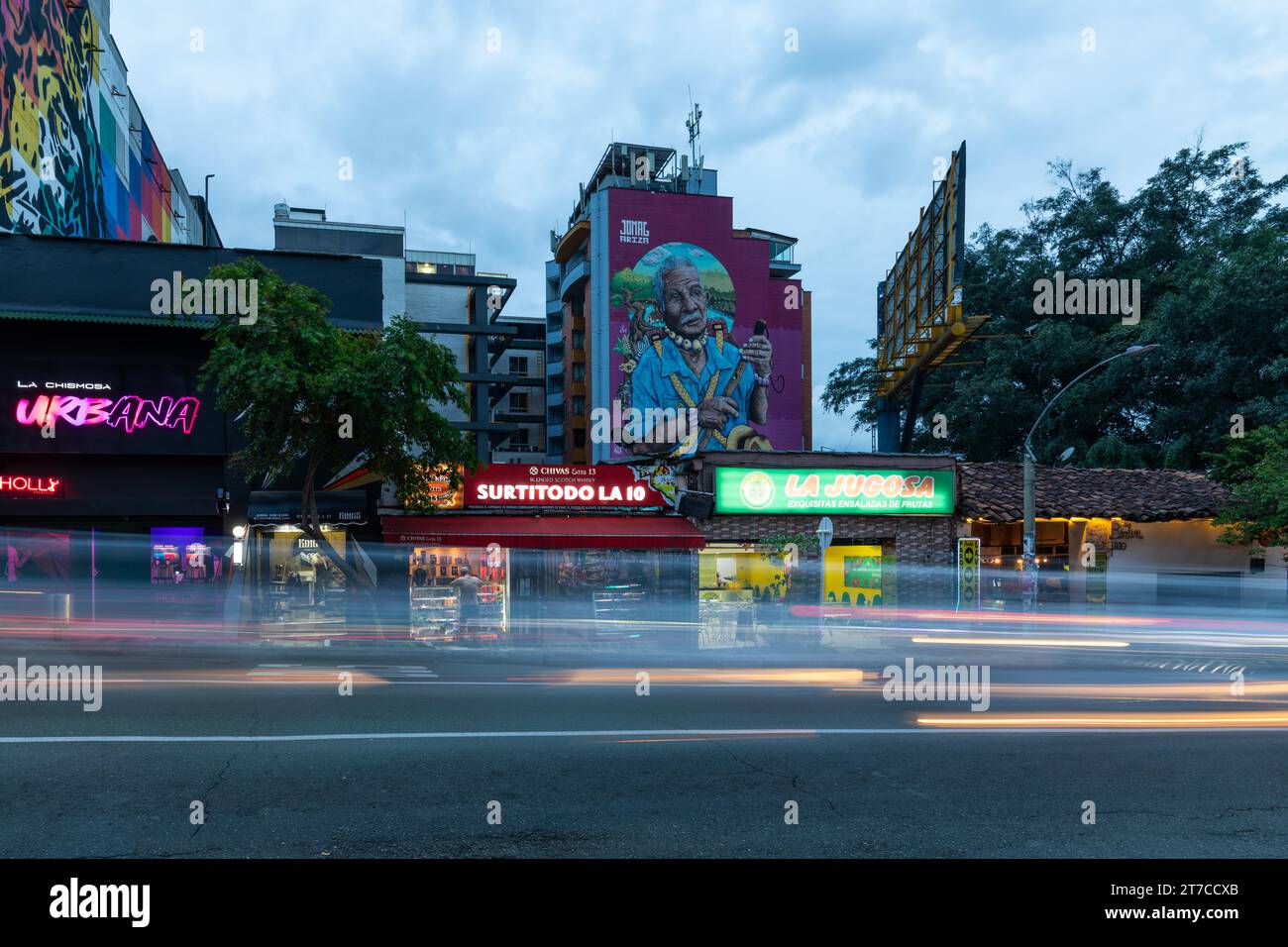 Residential and commercial building with graffiti on the wall, traffic ...