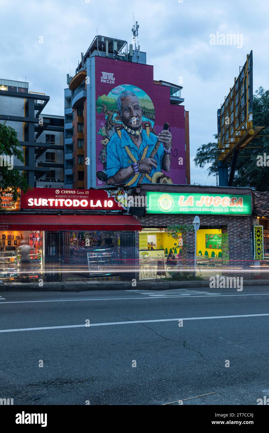 Residential and commercial building with graffiti on the wall, traffic ...